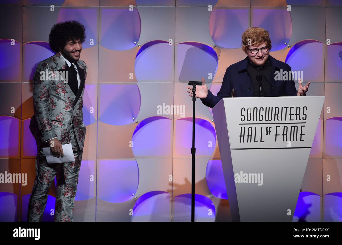 Singer-songwriter Ed Sheeran, right, thanks his presenter, Benny Blanco ...