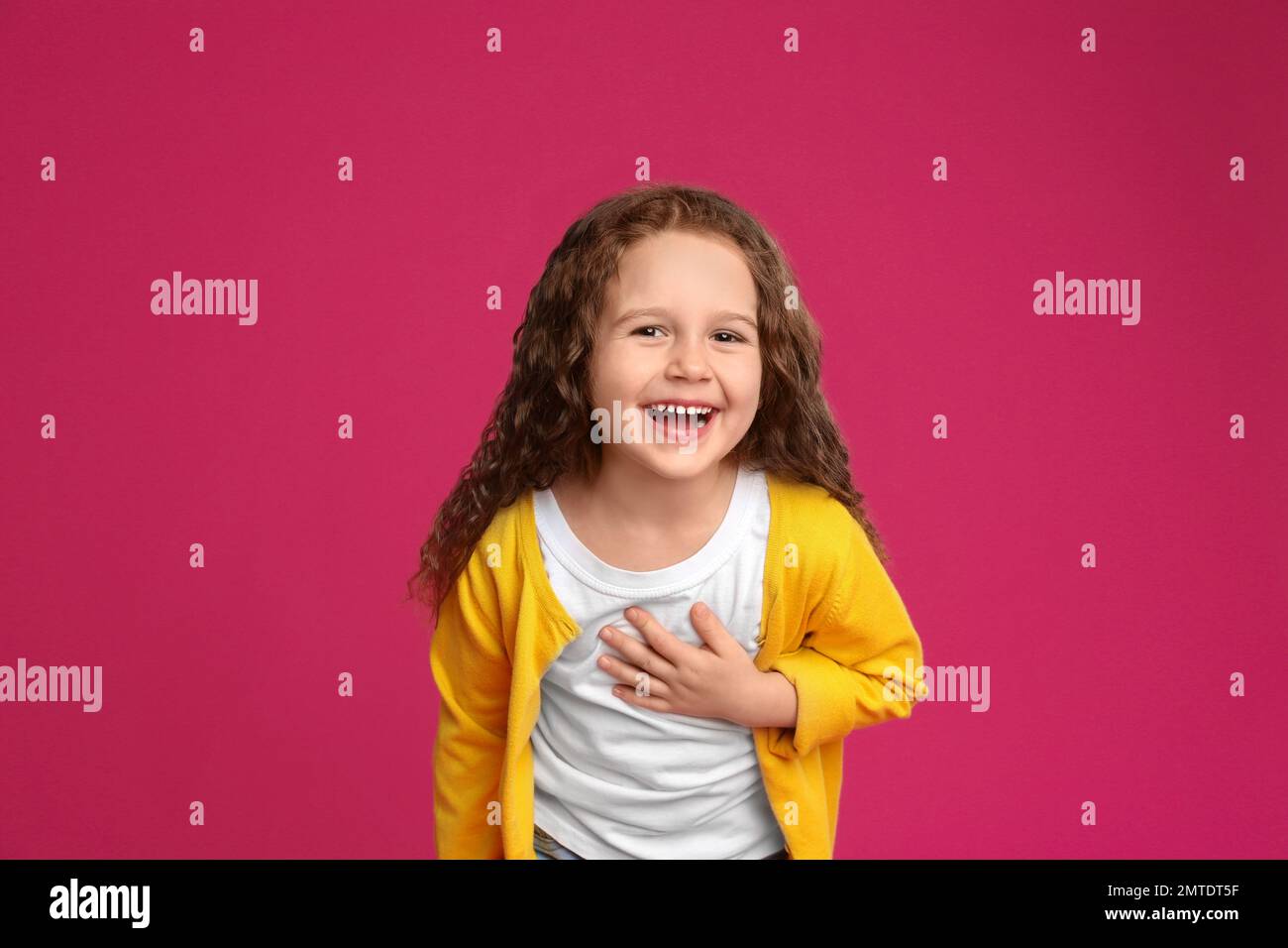 Portrait of cute little girl on pink background Stock Photo - Alamy