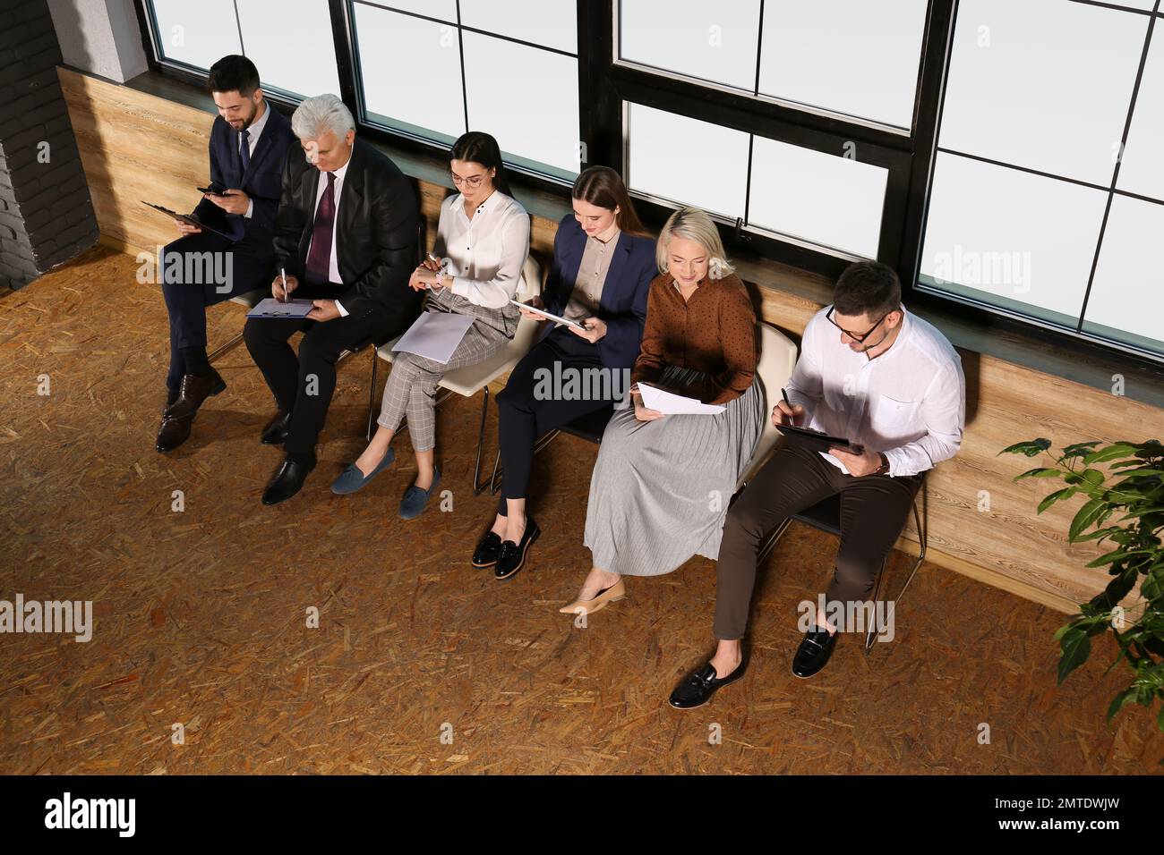 People waiting for job interview in office hall, above view Stock Photo ...
