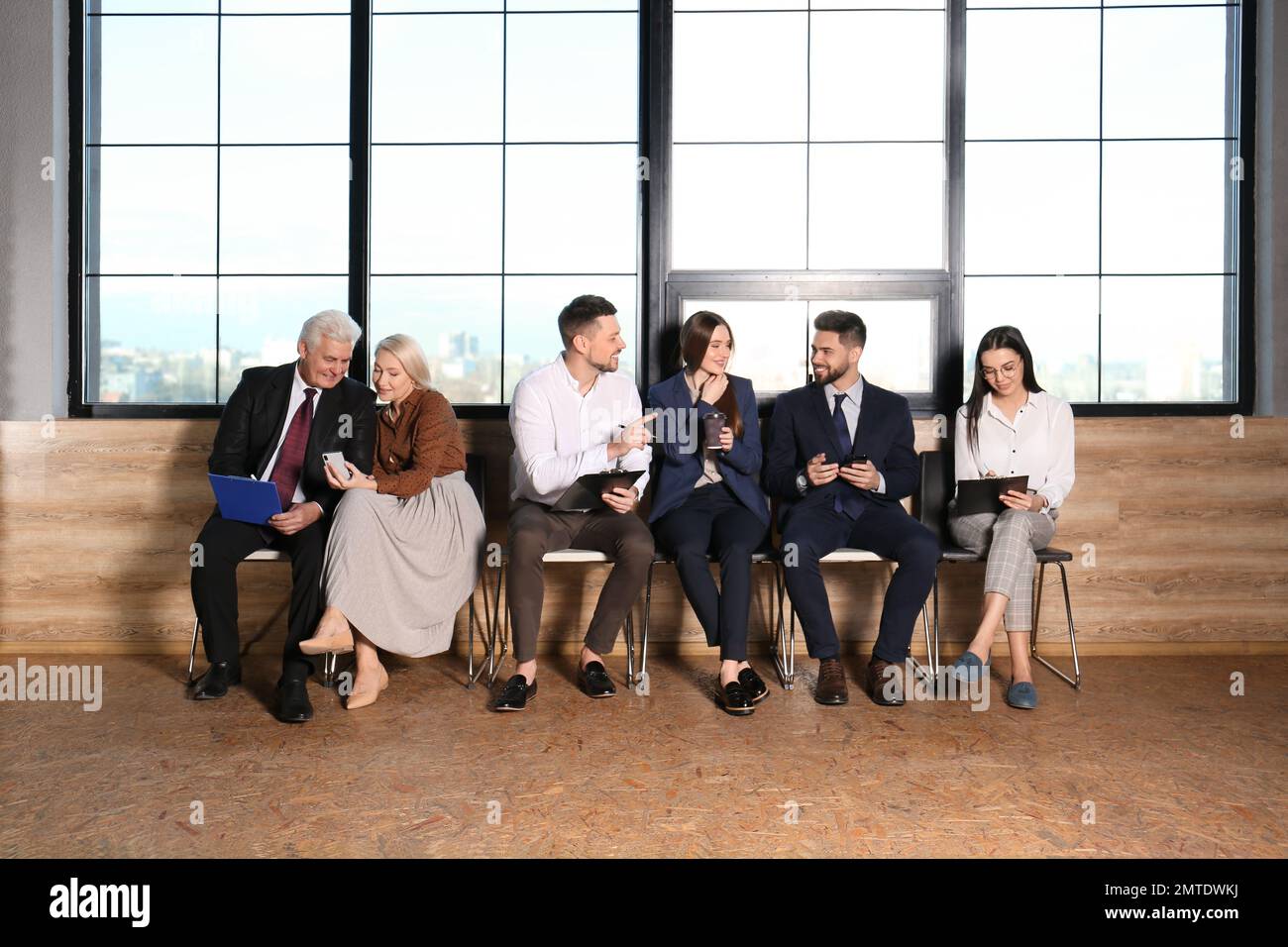 People waiting for job interview in office hall Stock Photo - Alamy