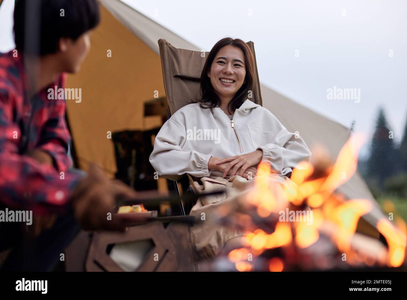 Young Japanese couple at campsite Stock Photo - Alamy