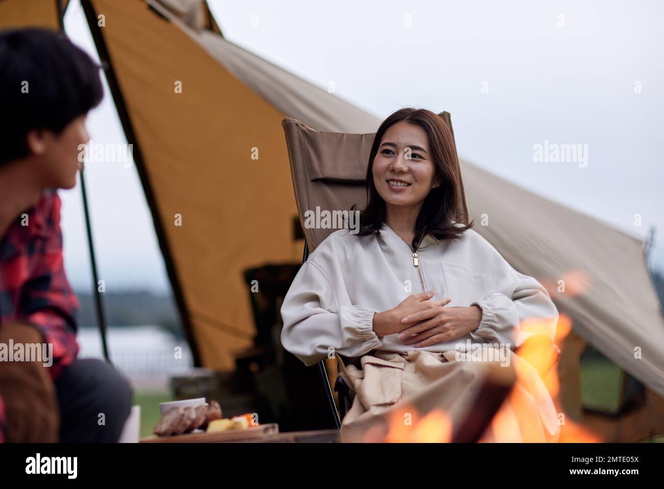 Young Japanese couple at campsite Stock Photo - Alamy