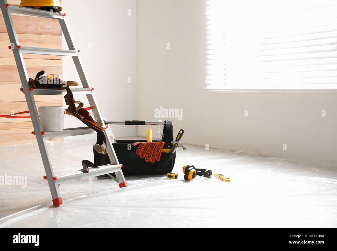 Stepladder and different tools in room. Interior renovation Stock Photo ...