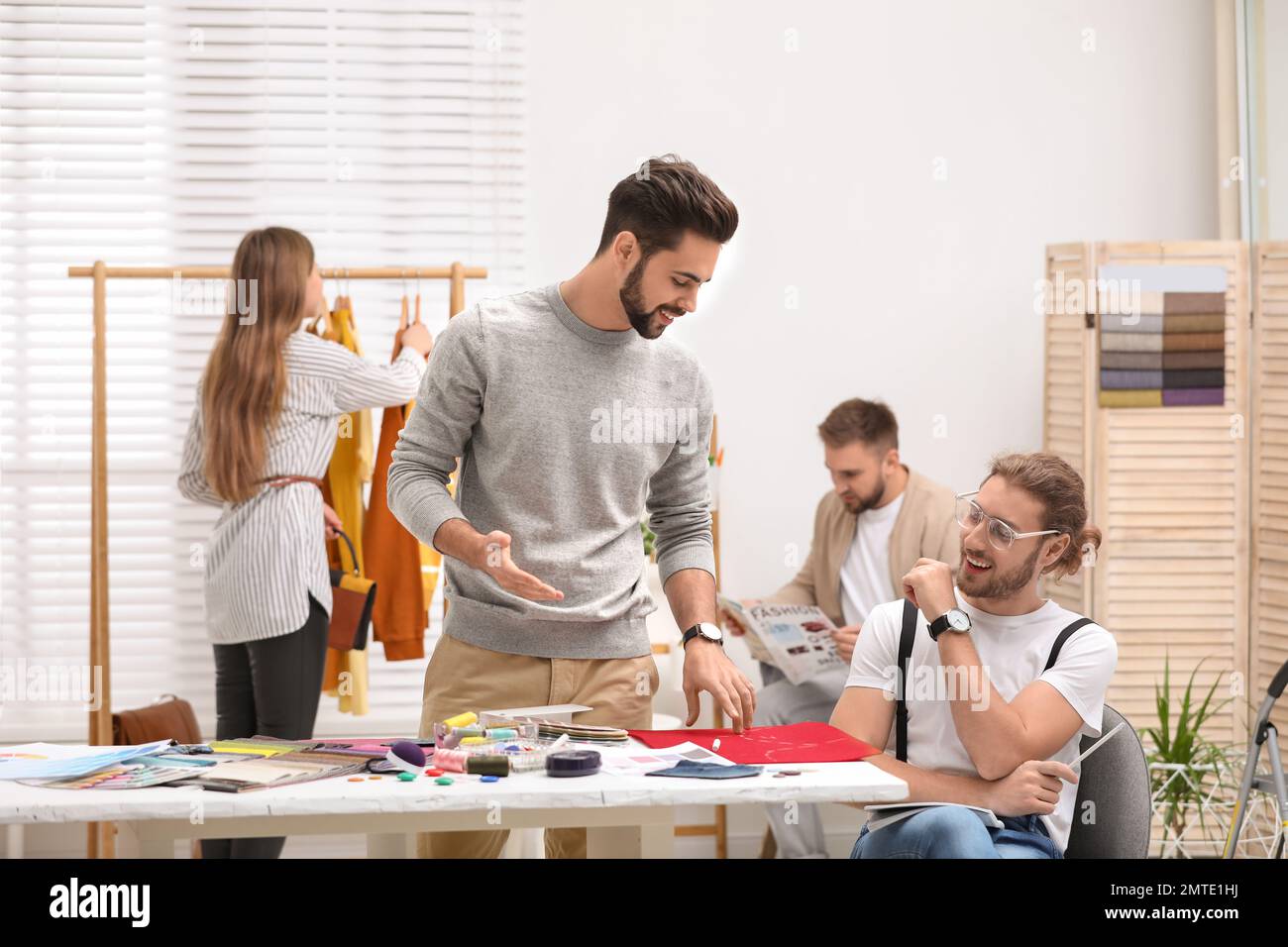 Fashion designers creating new clothes in studio Stock Photo - Alamy