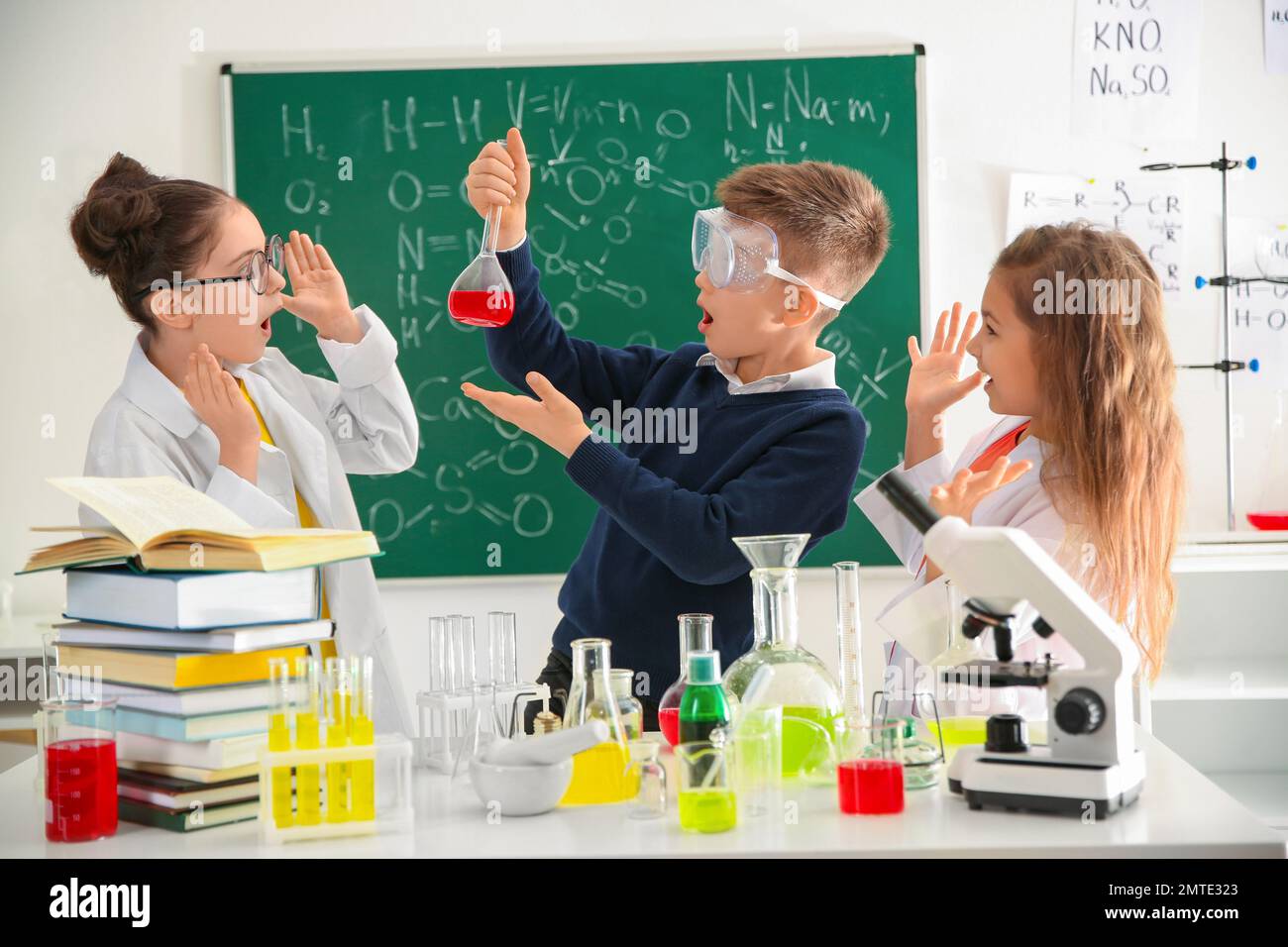Smart pupils making experiment in chemistry class Stock Photo - Alamy