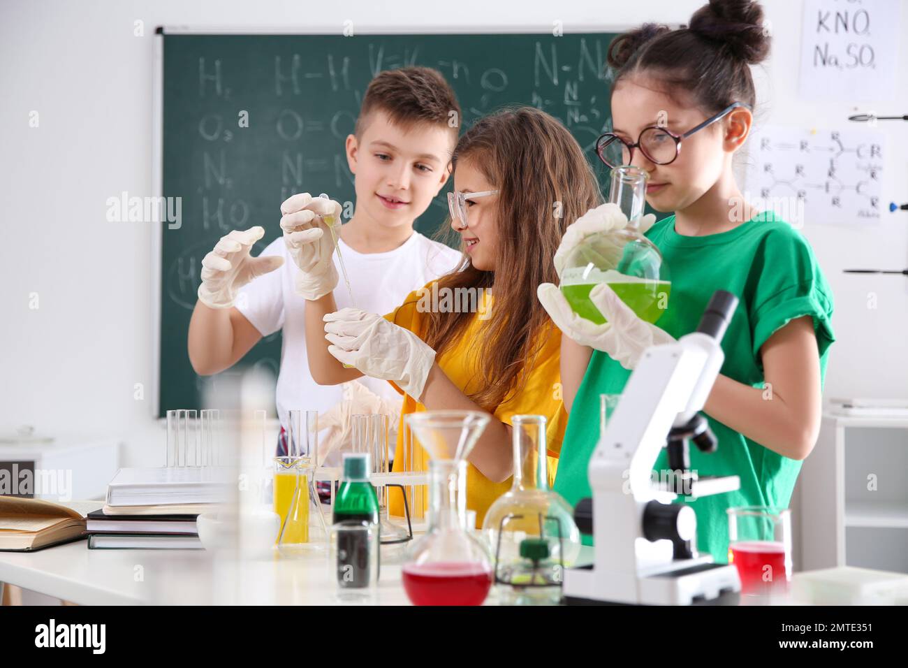 Smart pupils making experiment in chemistry class Stock Photo - Alamy
