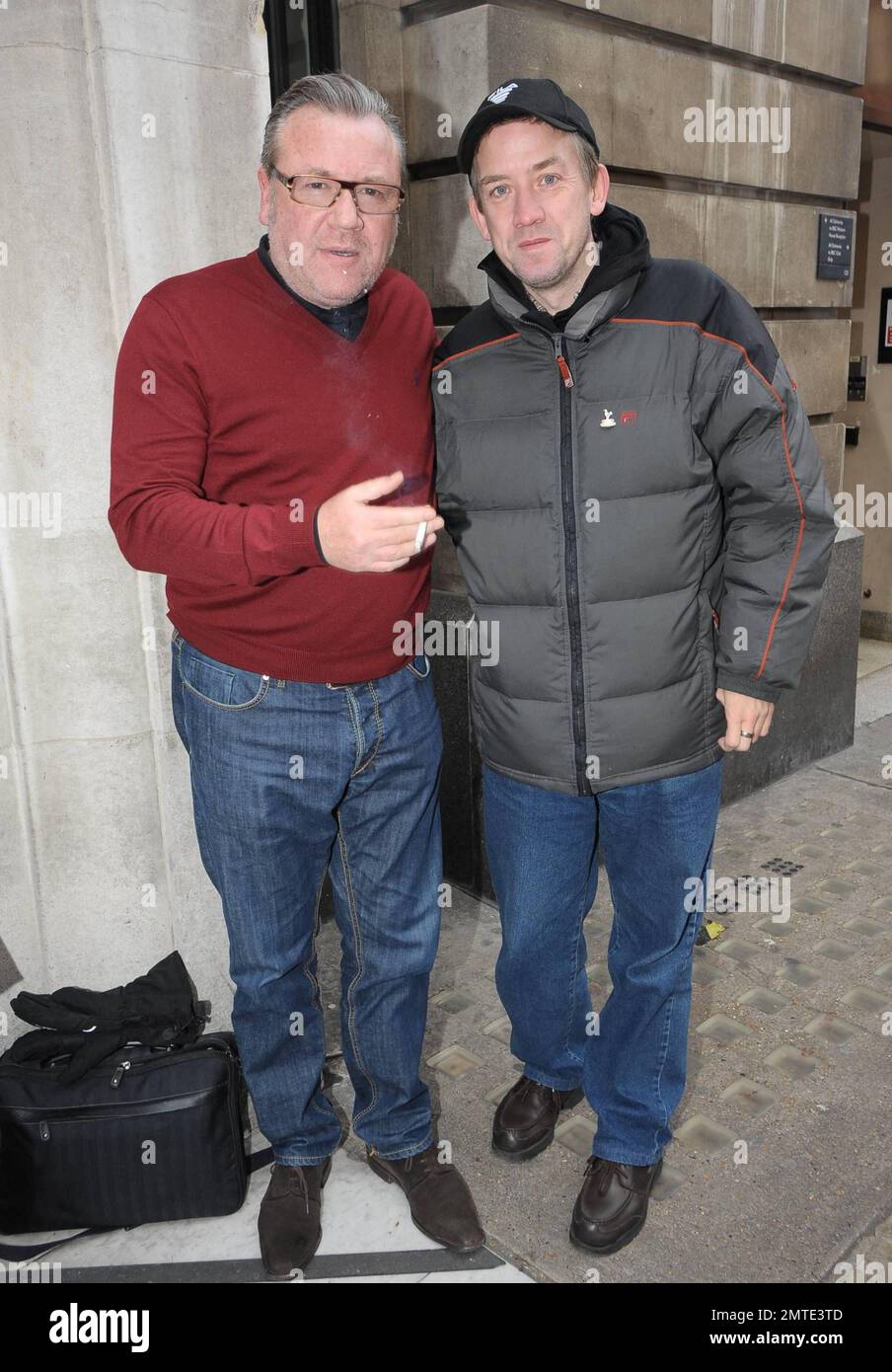 Actor Ray Winstone poses for photos with fans while outside enjoying a ...