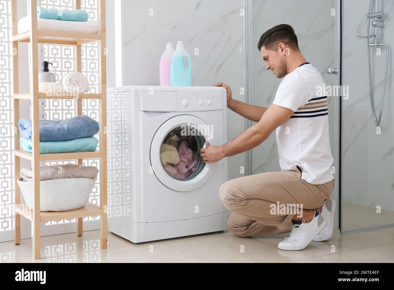 Man near washing machine hi-res stock photography and images - Alamy