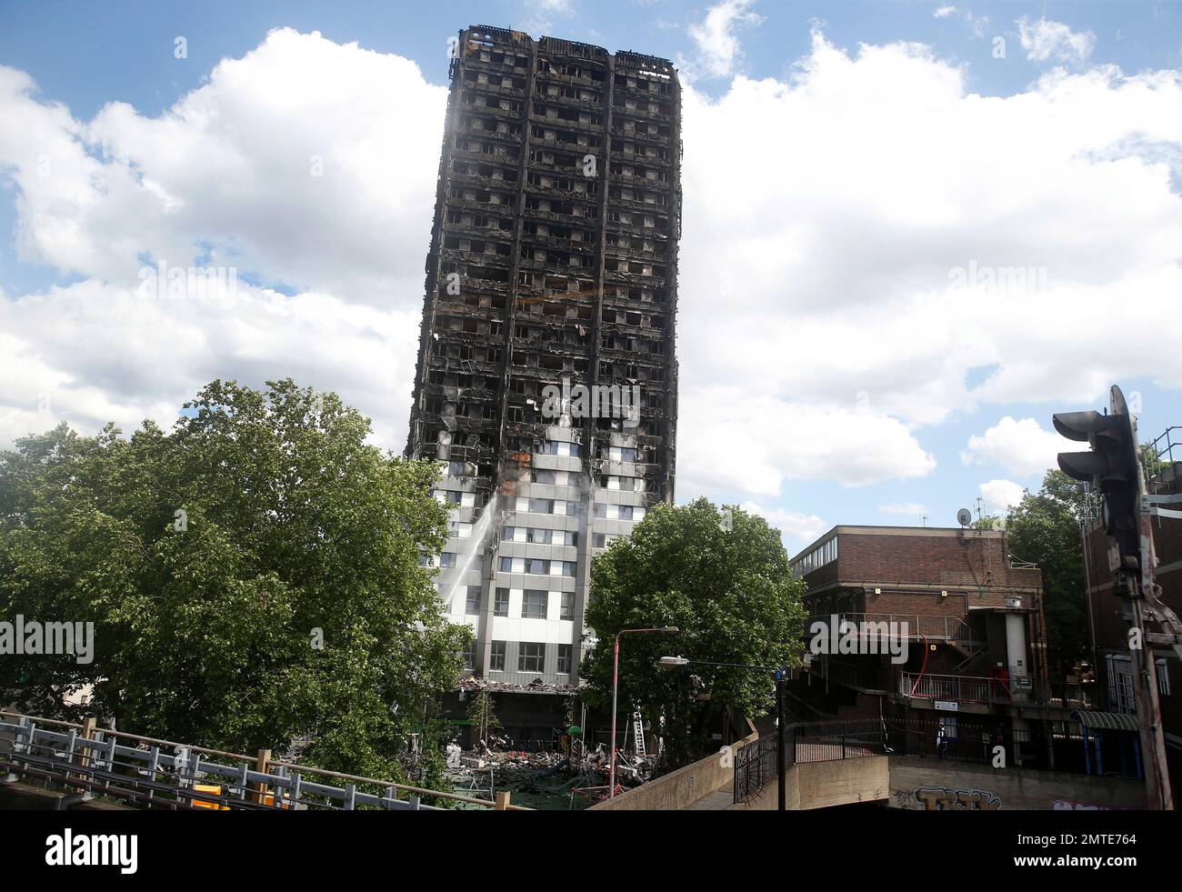 A view of the charred facade of the Grenfell Tower in London, Thursday ...
