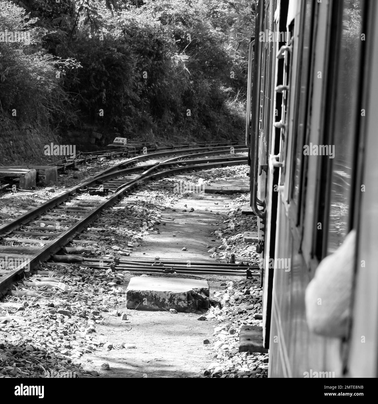 Toy Train moving on mountain slope, beautiful view, one side mountain ...