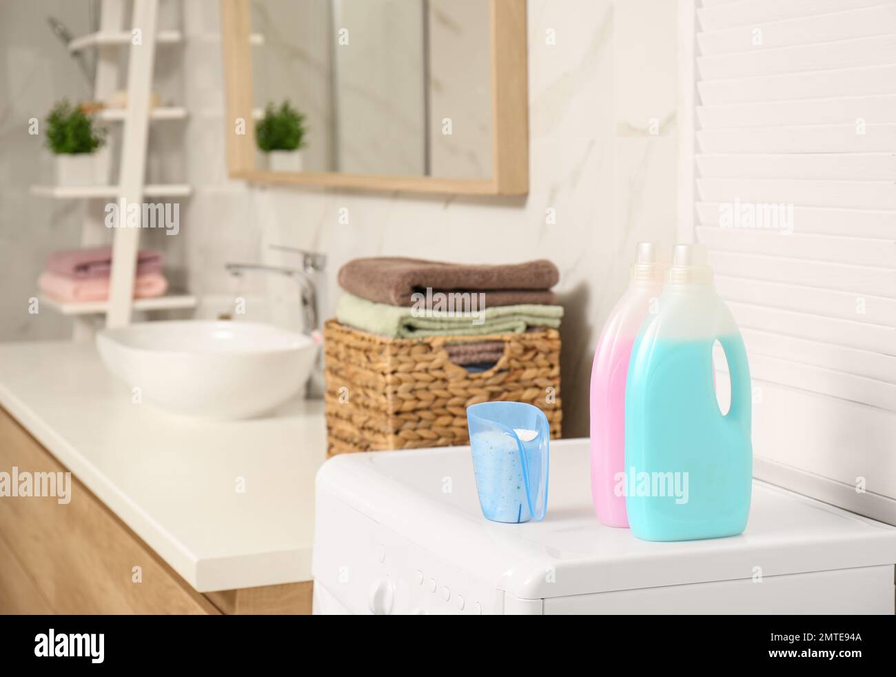 Different detergents on washing machine in bathroom. Laundry day Stock ...