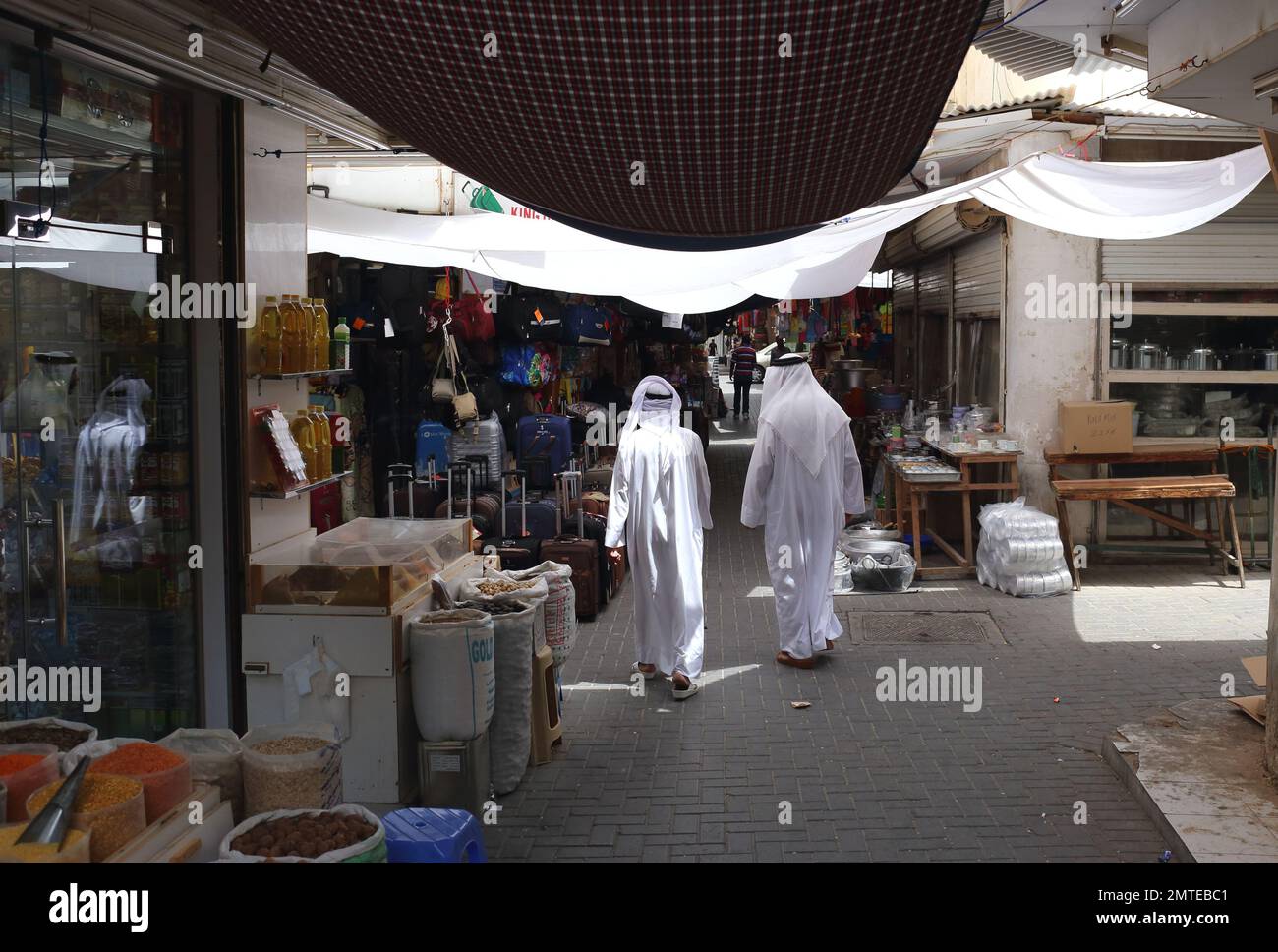 Two Bahraini men walking through the Manama Souk, Manama, Kingdom of ...