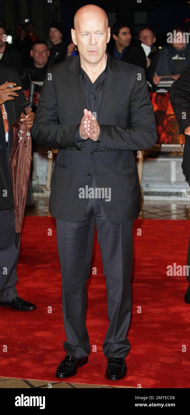 Bruce Willis walks the red carpet for the UK premiere of the action ...