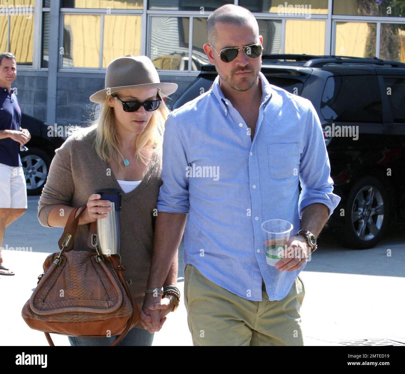 Actress Reese Witherspoon and husband Jim Toth were seen holding hands ...