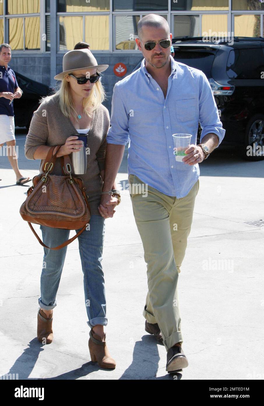 Actress Reese Witherspoon and husband Jim Toth were seen holding hands ...