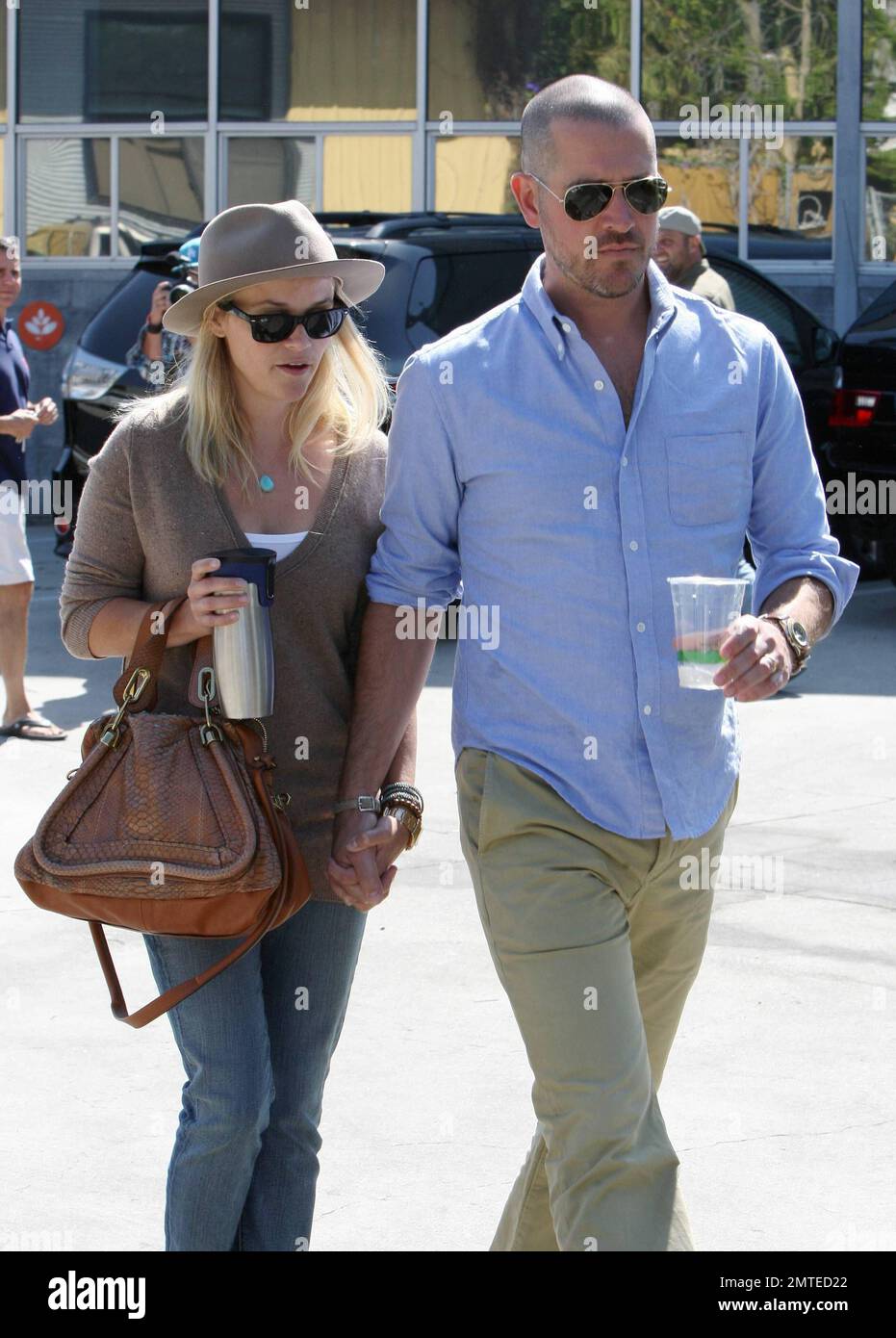 Actress Reese Witherspoon and husband Jim Toth were seen holding hands ...