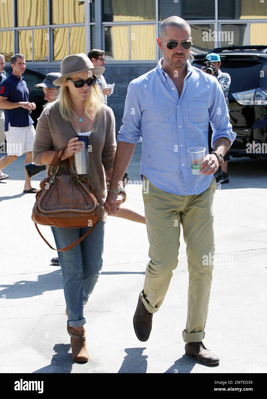Actress Reese Witherspoon and husband Jim Toth were seen holding hands ...