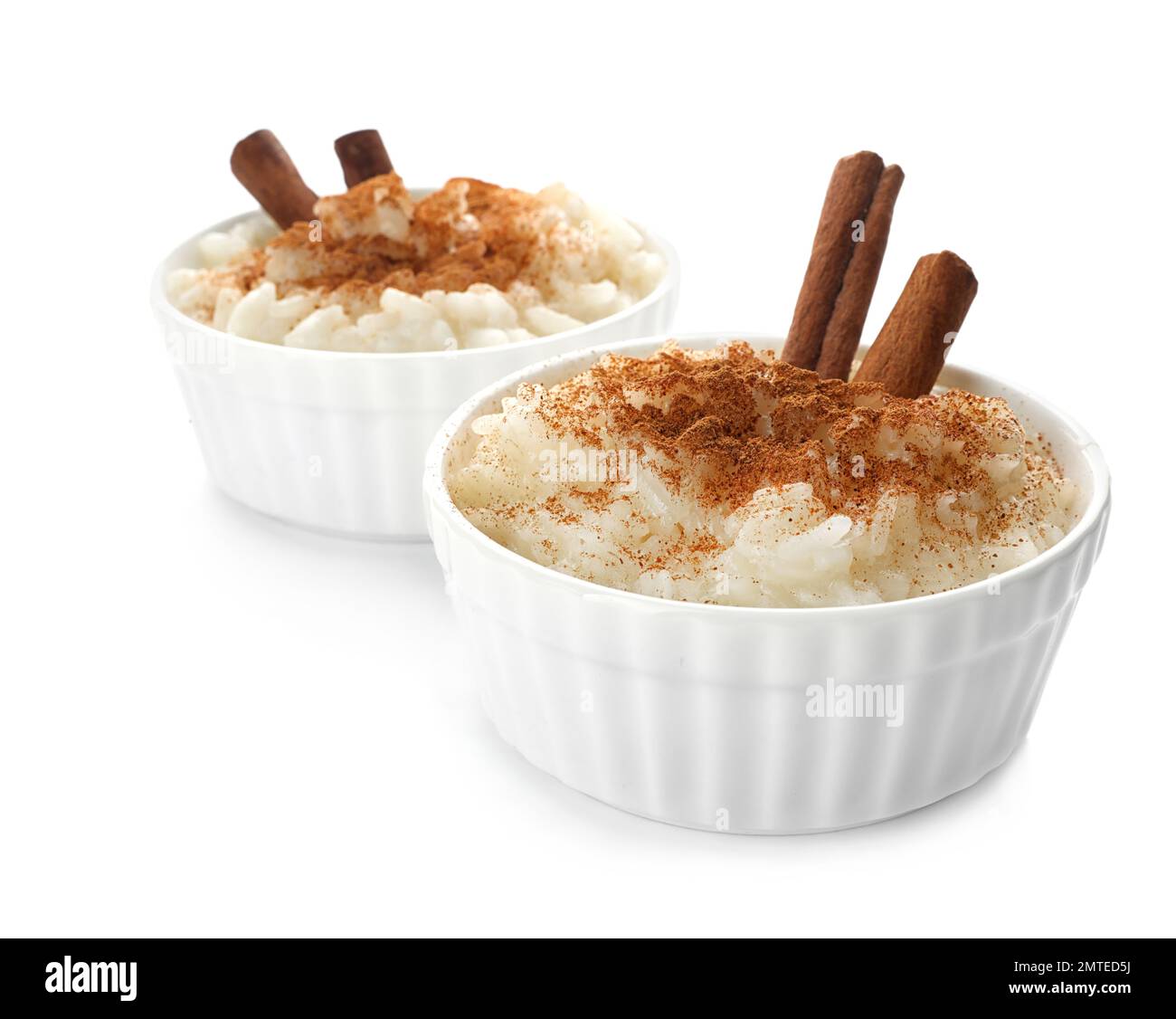 Delicious rice pudding with cinnamon isolated on white Stock Photo - Alamy