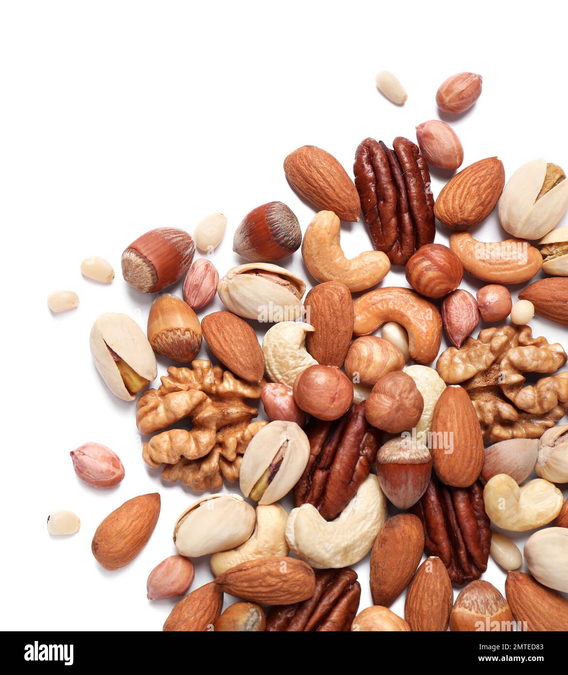 Different delicious nuts on white background, flat lay. Space for text ...