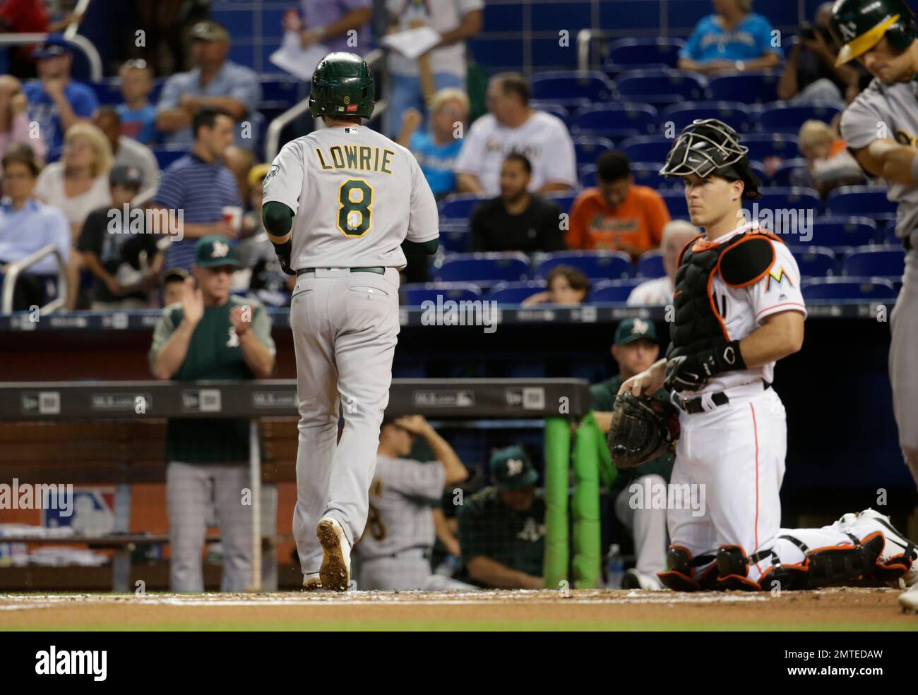 Oakland Athletics' Jed Lowrie (8) scores on bases loaded walk by ...