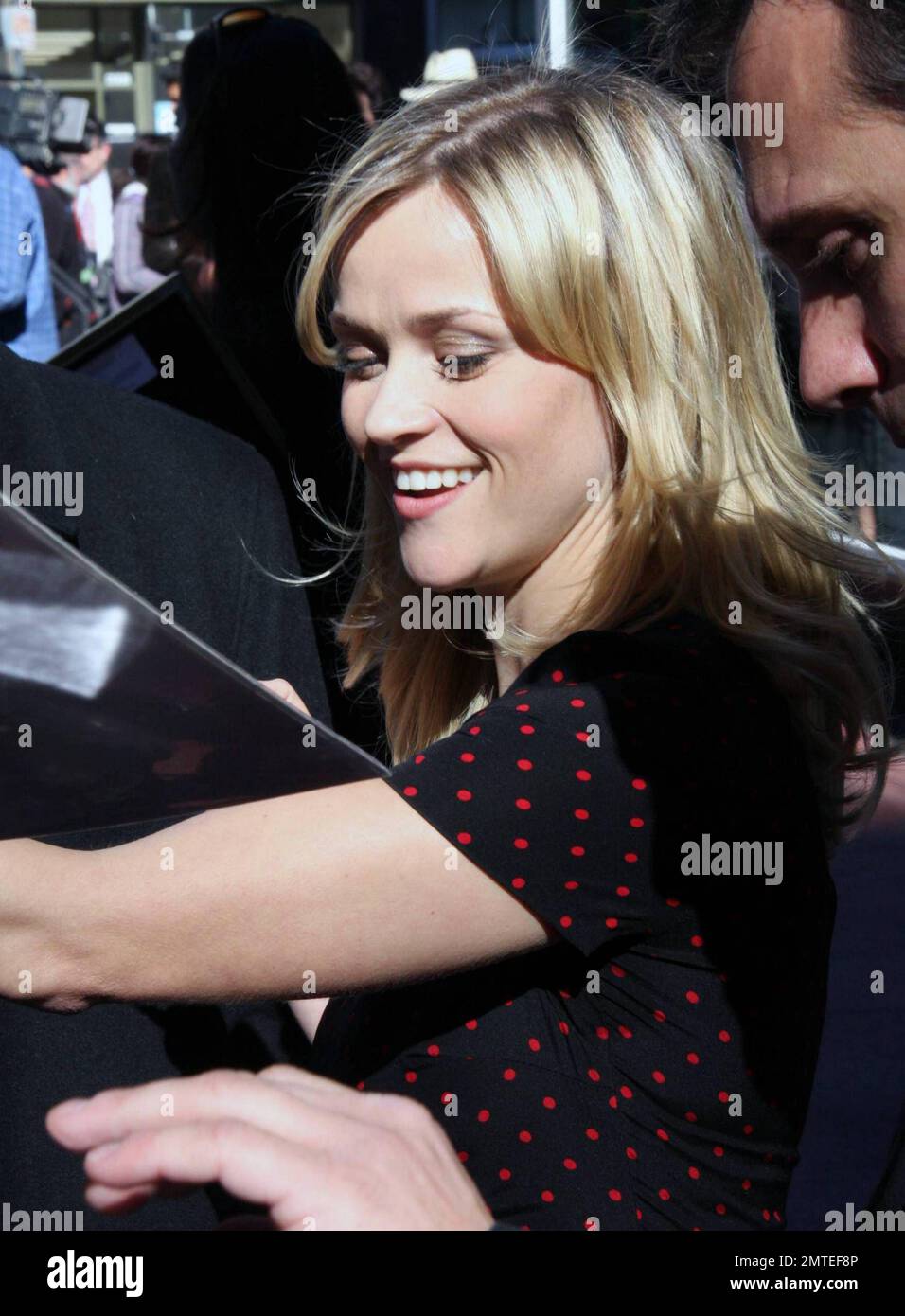 Clad in a classic polka dot afternoon dress and cherry red high heels, America's sweetheart ...