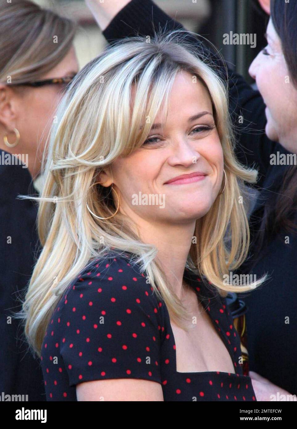 Clad in a classic polka dot afternoon dress and cherry red high heels, America's sweetheart ...