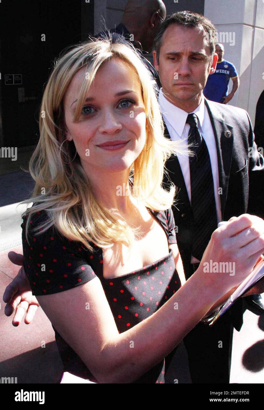 Clad in a classic polka dot afternoon dress and cherry red high heels, America's sweetheart ...