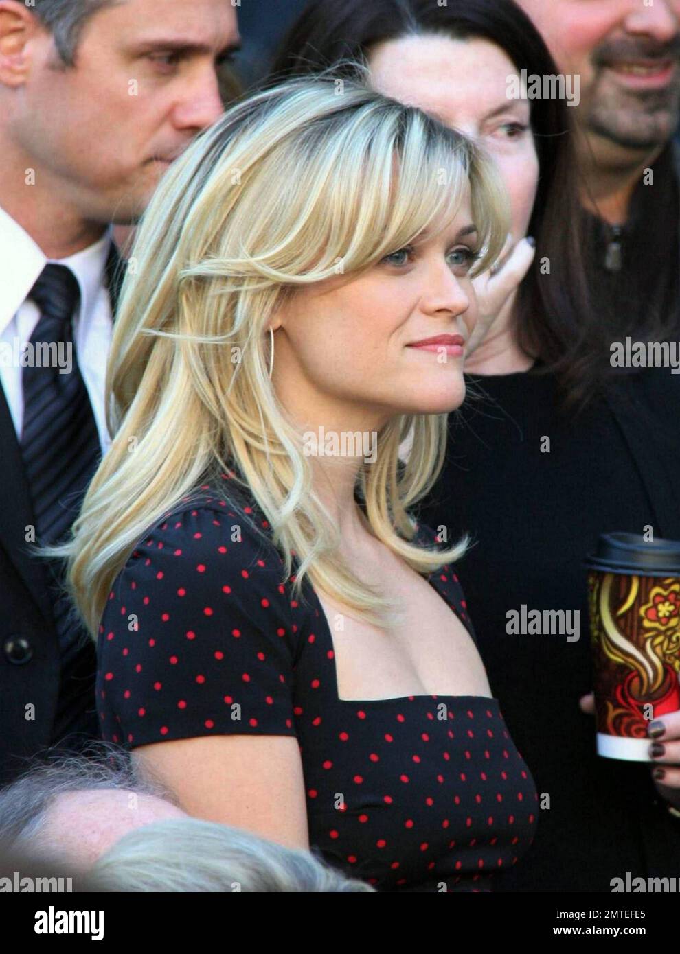 Clad in a classic polka dot afternoon dress and cherry red high heels, America's sweetheart ...