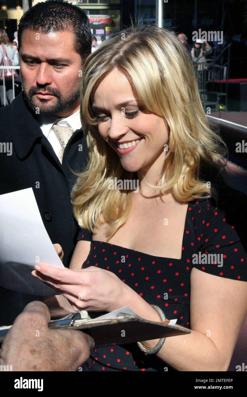 Clad in a classic polka dot afternoon dress and cherry red high heels, America's sweetheart ...