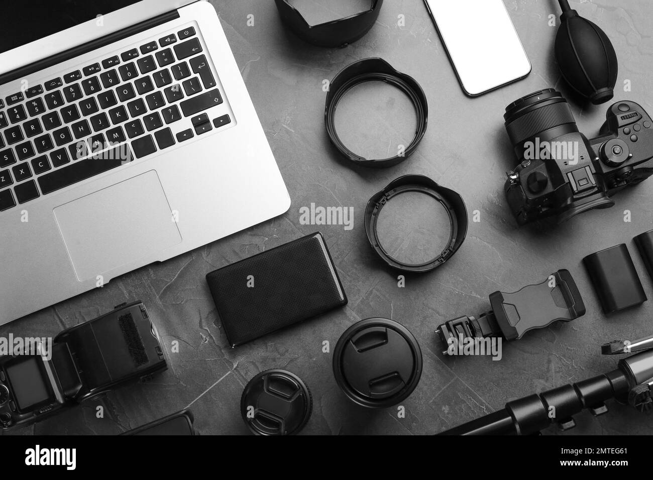 Flat lay composition with camera and video production equipment on grey ...