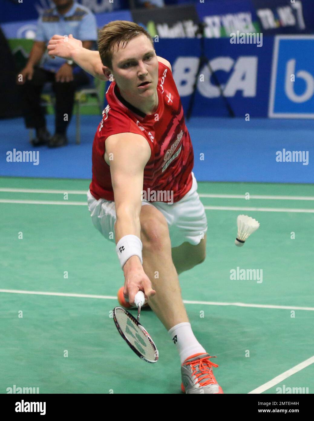Denmark's Viktor Axelsen returns the shuttlecock to Denmark's Emil ...