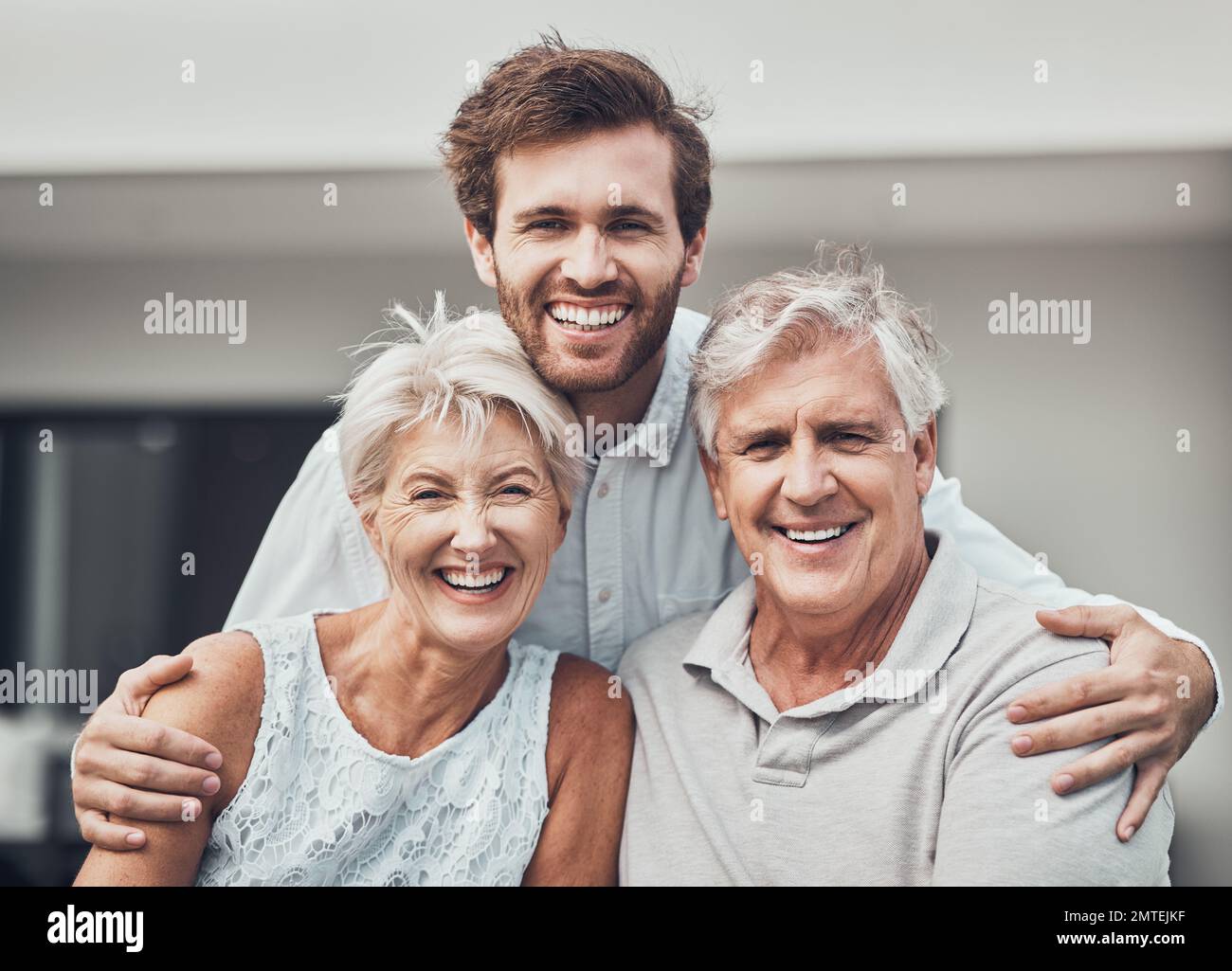 Family, smile portrait and hug for new home property, homeowner real ...