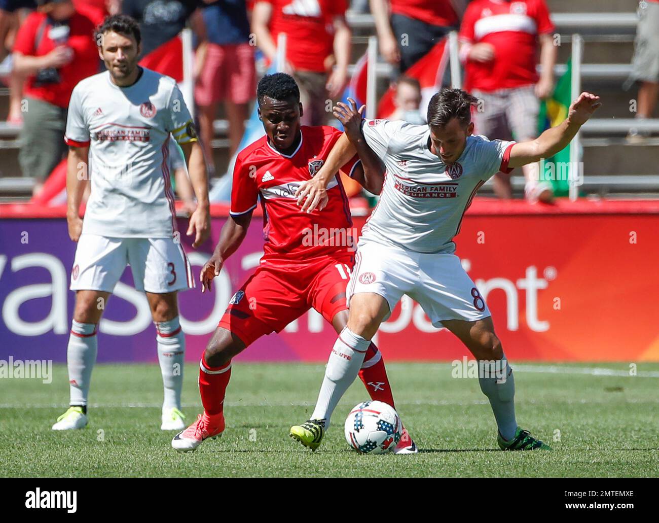 Atlanta United midfielder Kevin Kratz, right, battles for the ball ...
