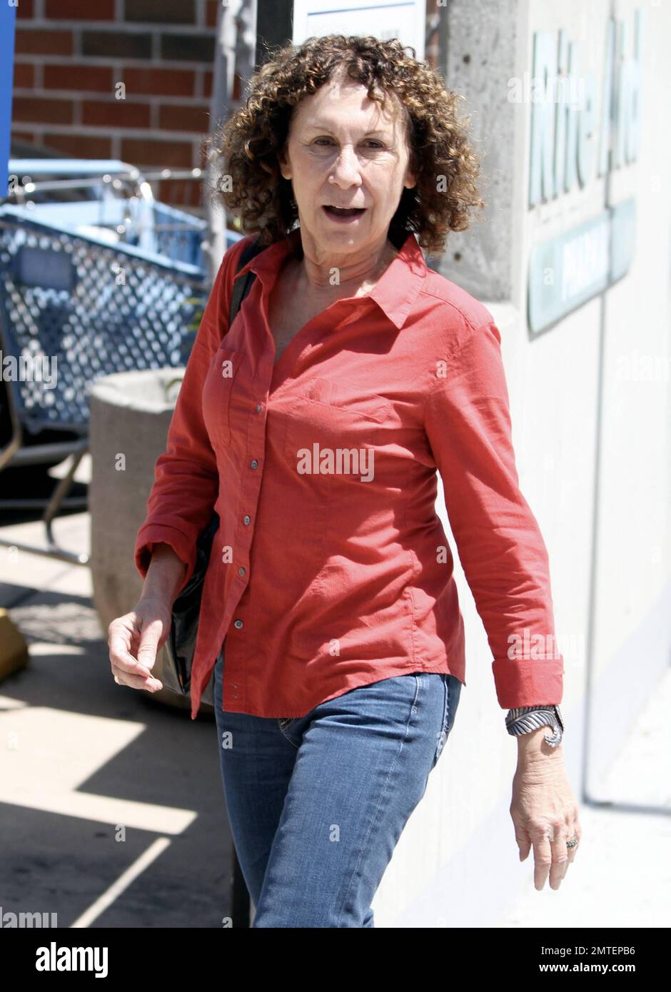 EXCLUSIVE!! Danny Devito's wife, actress Rhea Perlman looks casual in a red top and jeans while ...