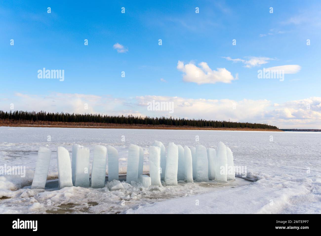 Cut ice with pillars for defrosting and eating stands covered with snow ...