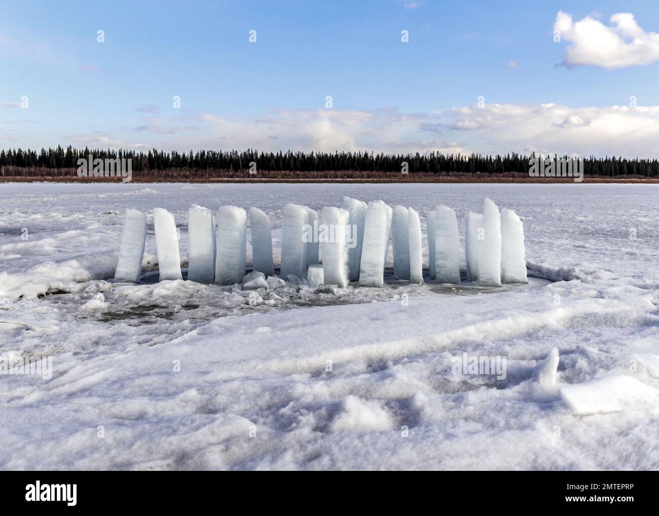 Cut ice with pillars for defrosting and eating stands covered with snow ...