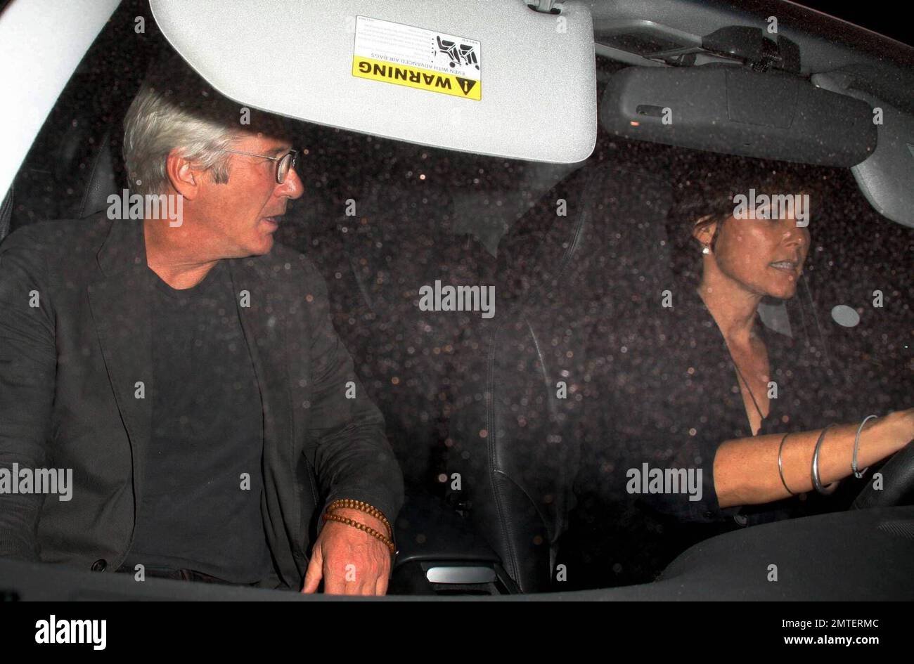 Actor Richard Gere and wife Carey Lowell leave the restaurant Madeo in ...