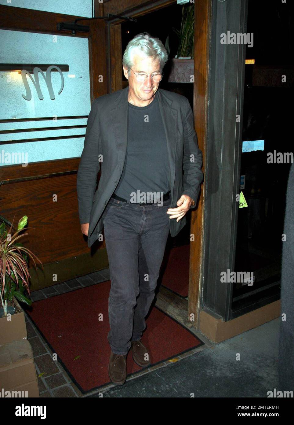 Actor Richard Gere and wife Carey Lowell leave the restaurant Madeo in ...