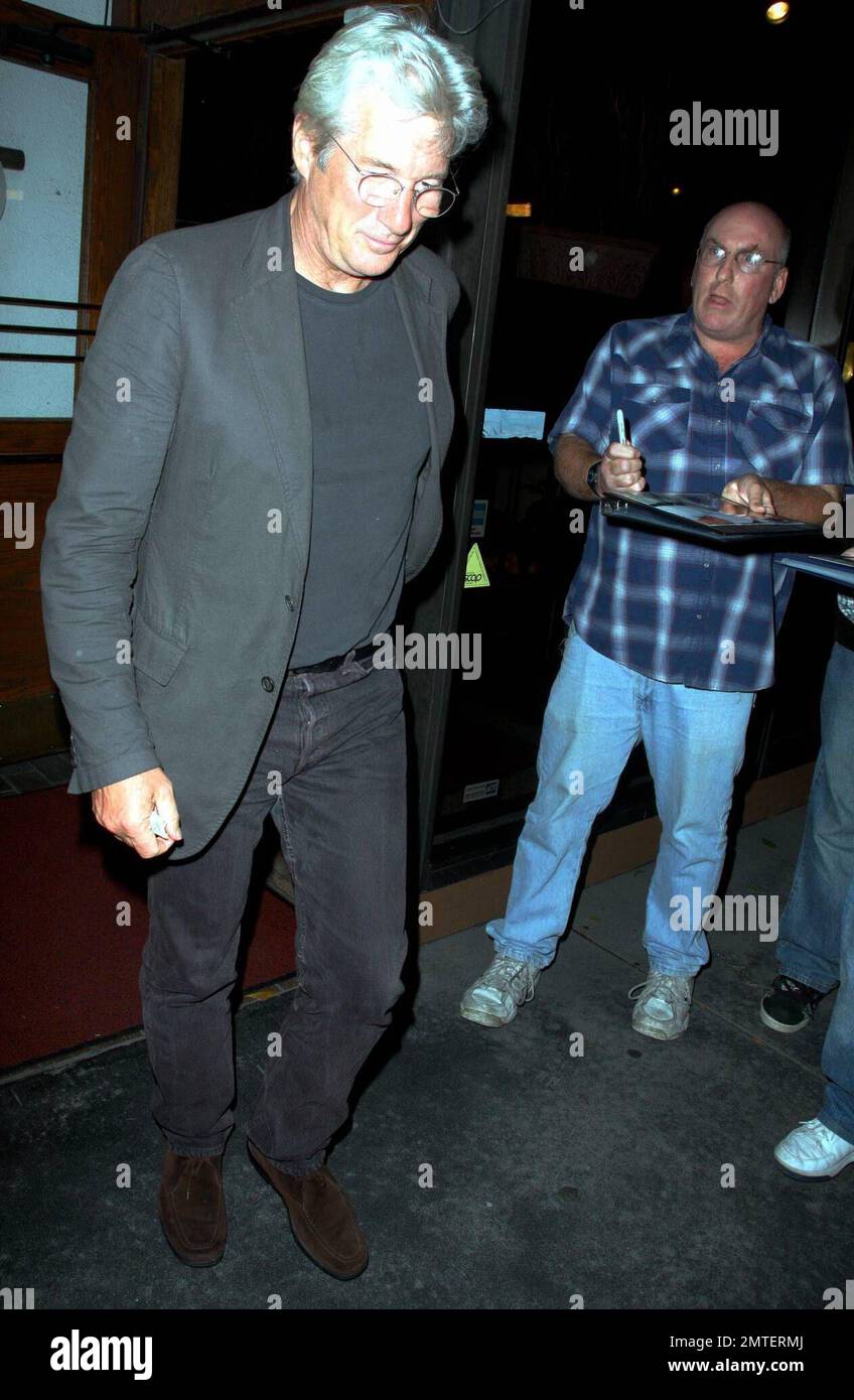 Actor Richard Gere and wife Carey Lowell leave the restaurant Madeo in ...