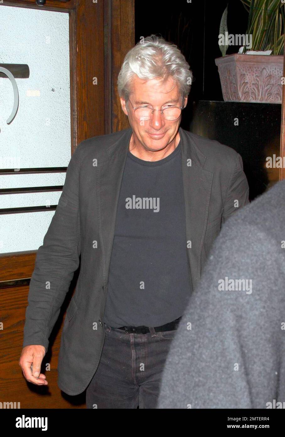 Actor Richard Gere and wife Carey Lowell leave the restaurant Madeo in ...