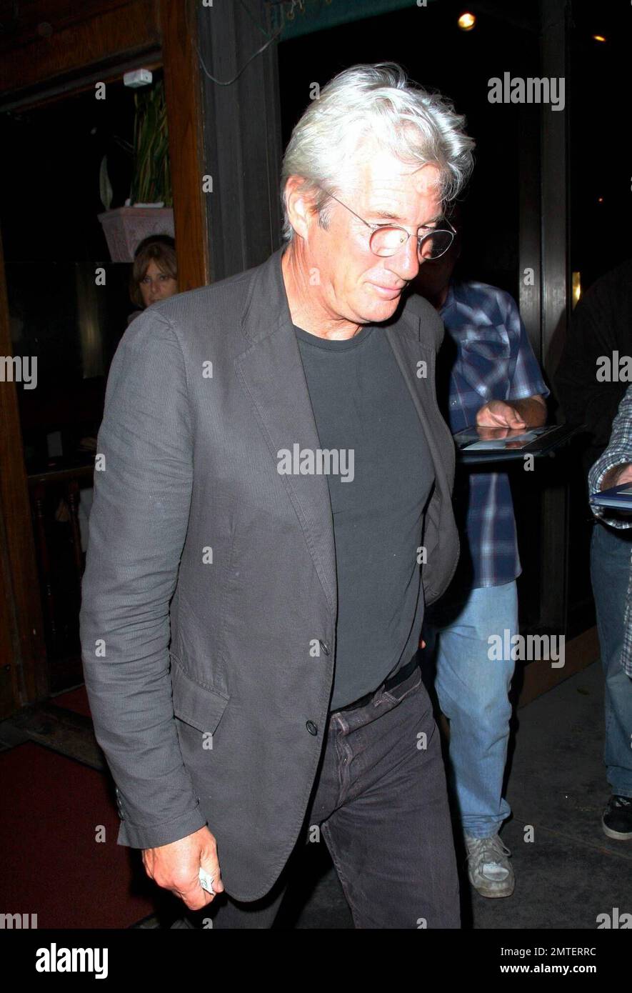 Actor Richard Gere and wife Carey Lowell leave the restaurant Madeo in ...