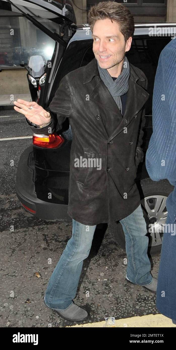 American singer Richard Marx waves to fans as he arrives at and later ...