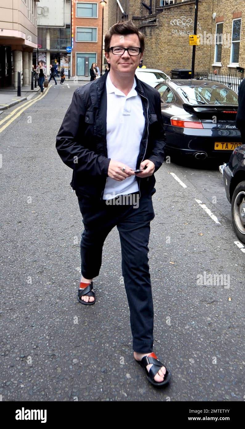 1980s singer Rick Astley wears a casual outfit with sandals as he takes ...