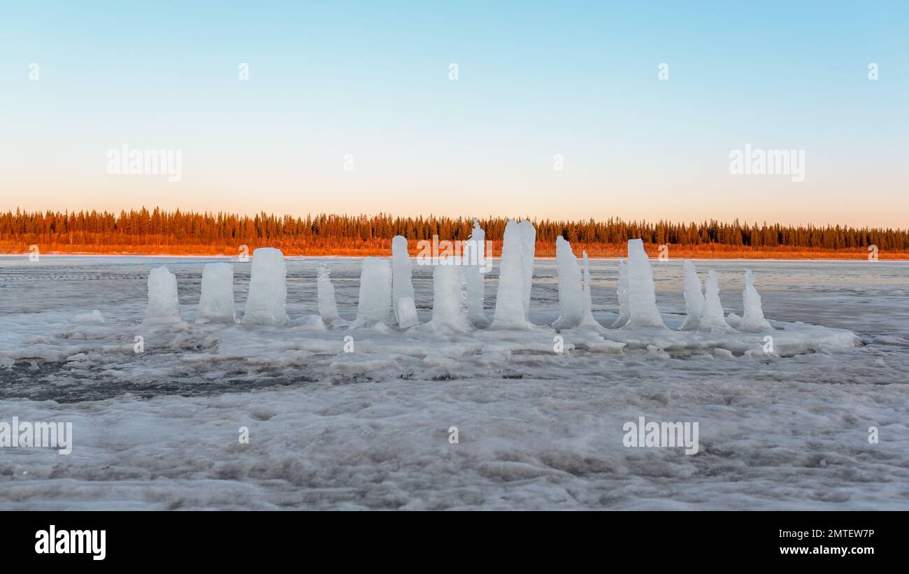 The remains of pillars of ice carved for drinking water melt standing ...