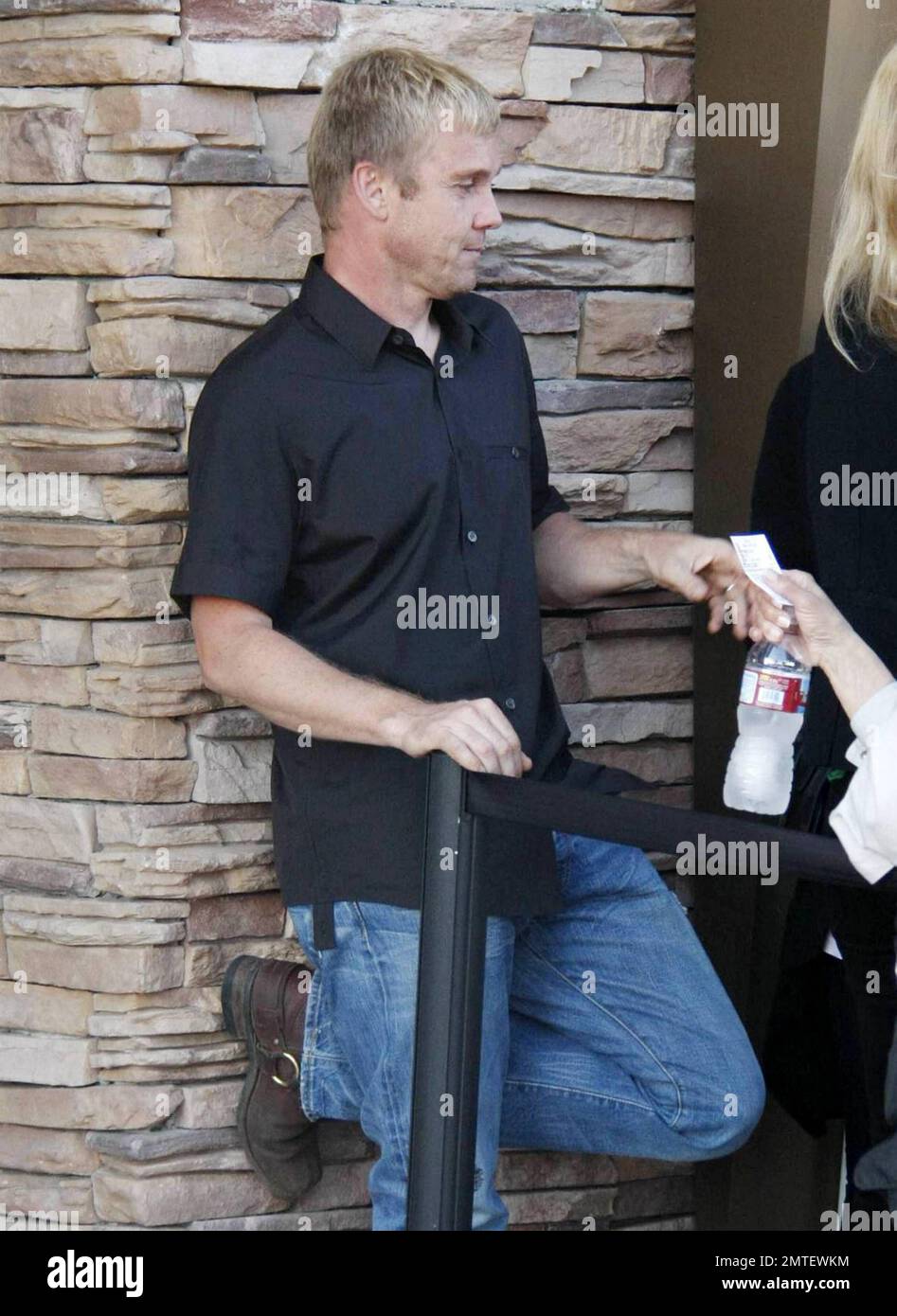 Actor Rick Schroder smiles and laughs with his wife Andrea Schroder and ...