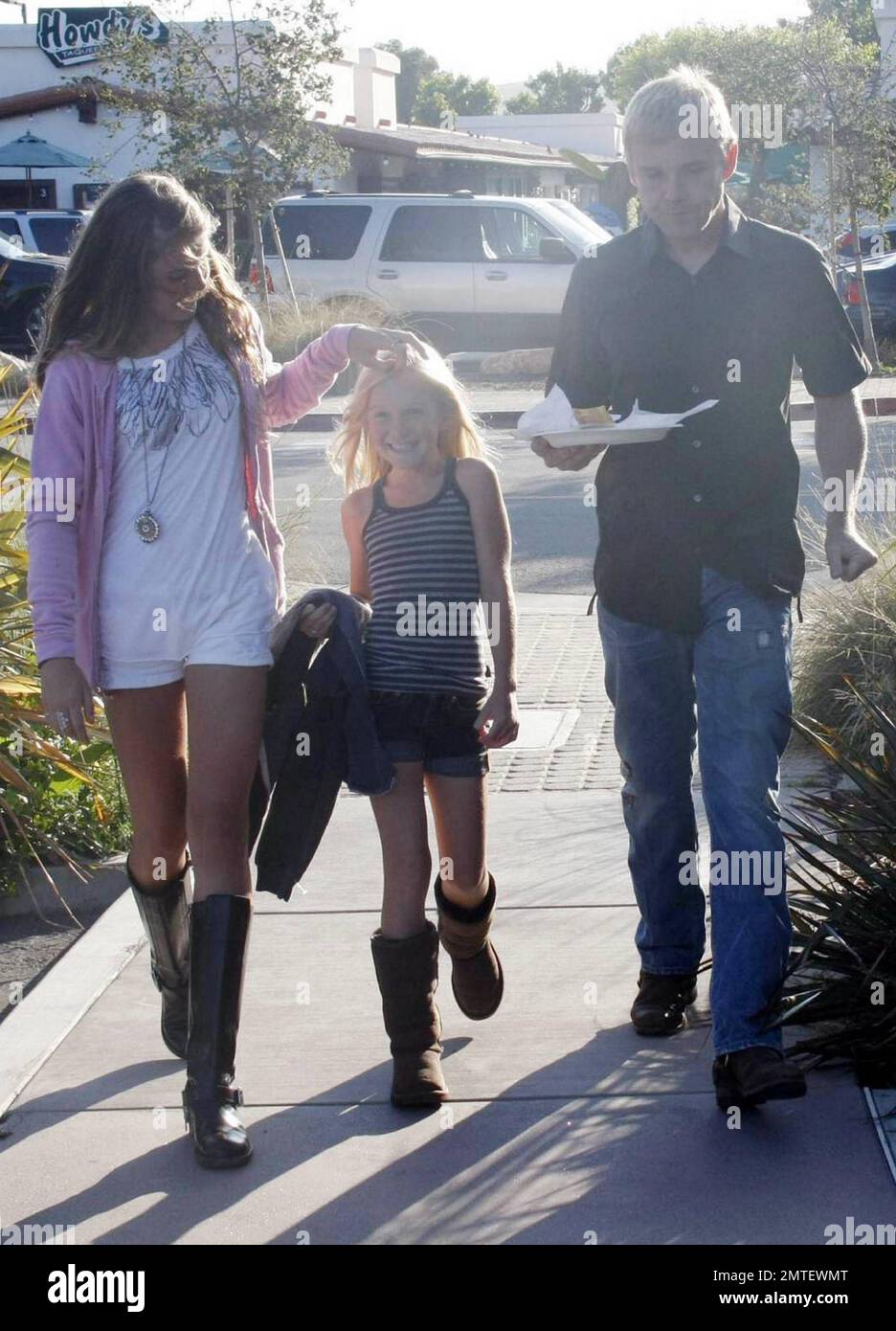 Actor Rick Schroder smiles and laughs with his wife Andrea Schroder and ...
