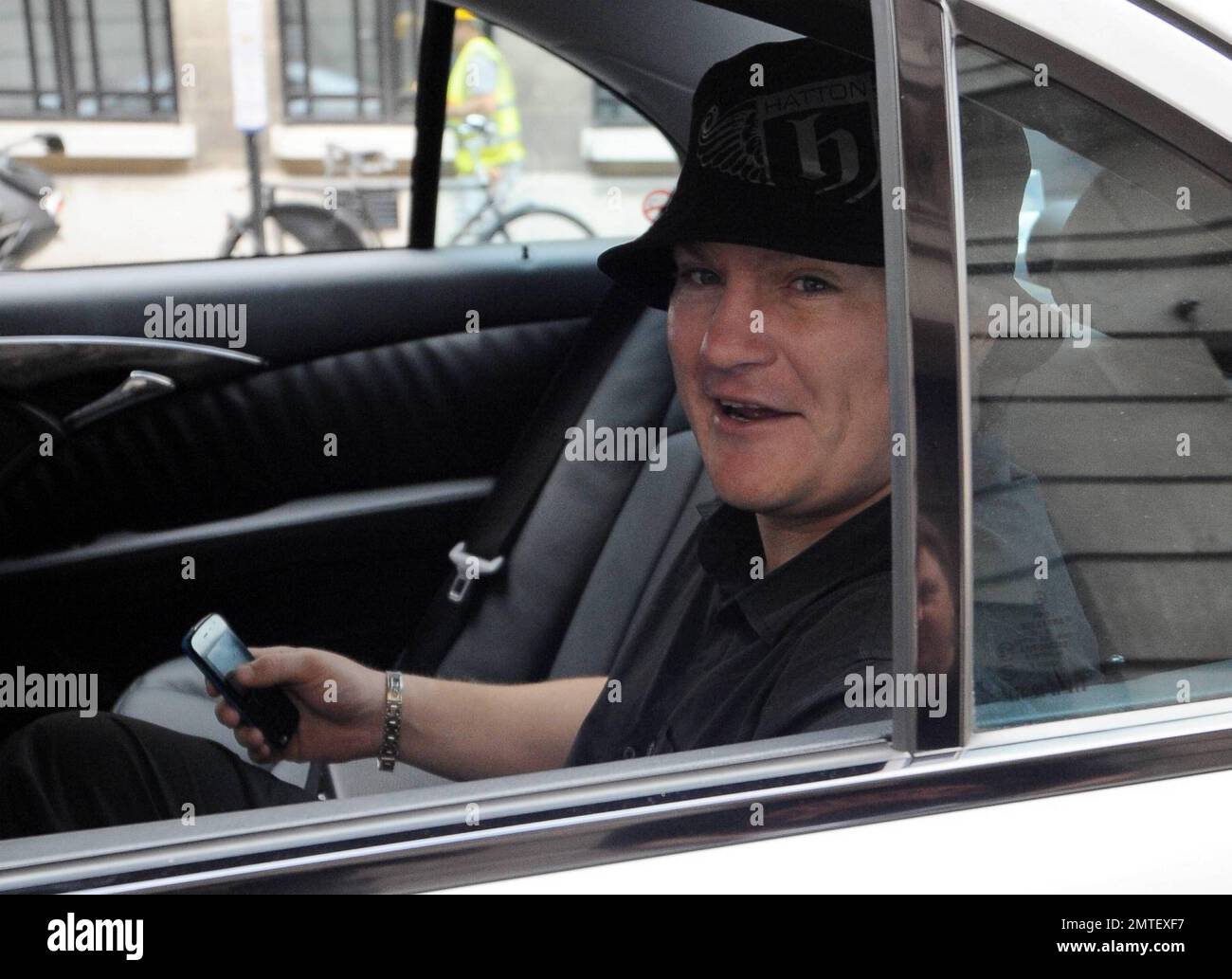 Boxing champ Ricky Hatton gets stuck in traffic. With his window down ...