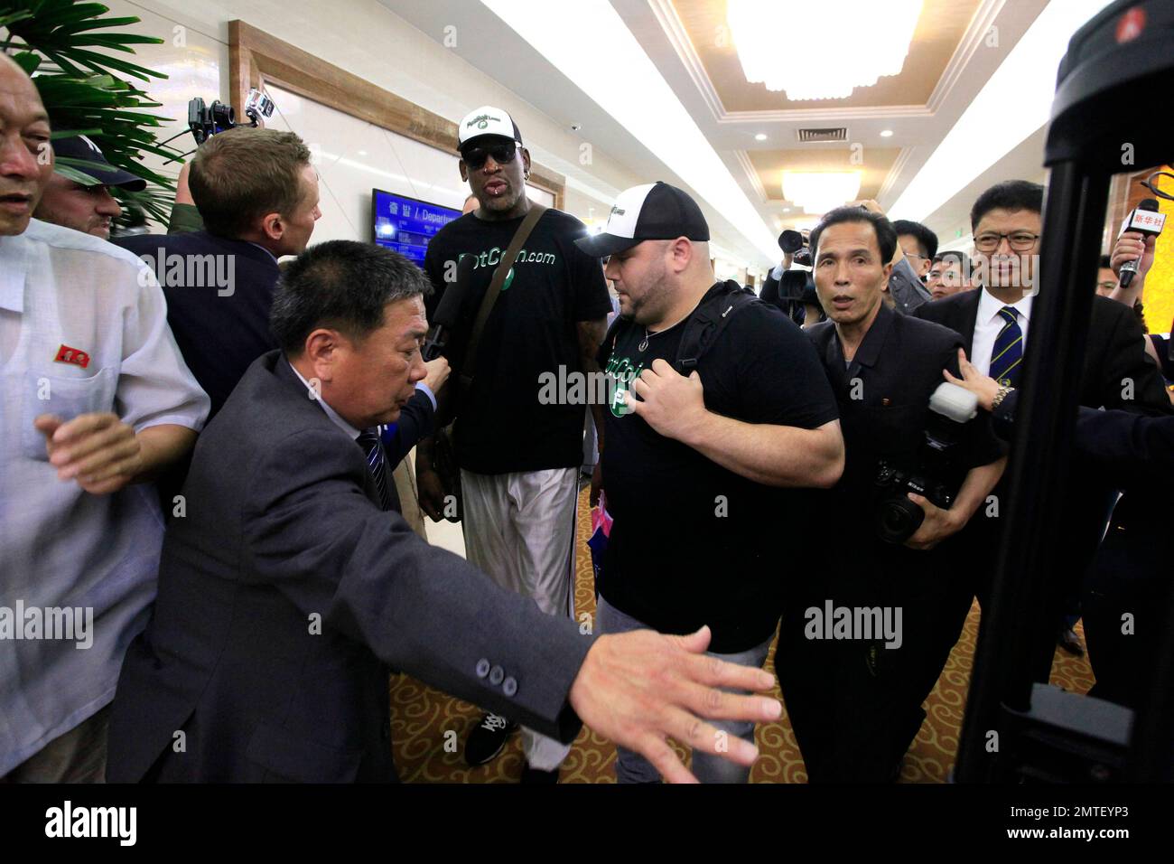 Former NBA basketball star Dennis Rodman is surrounded by North Korean ...