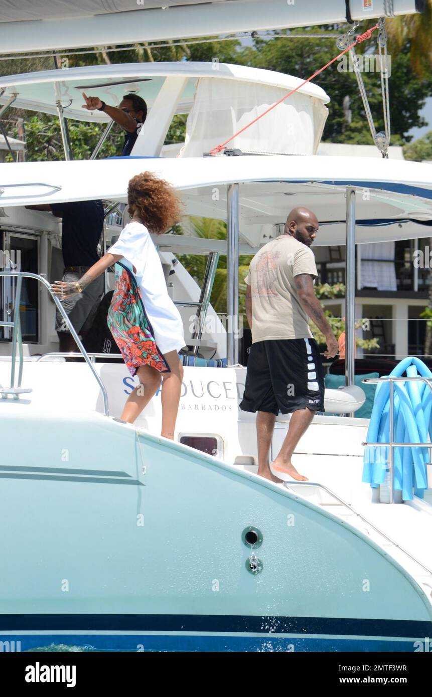 Rihanna is joined by rumored love interest, racing car driver, Lewis ...