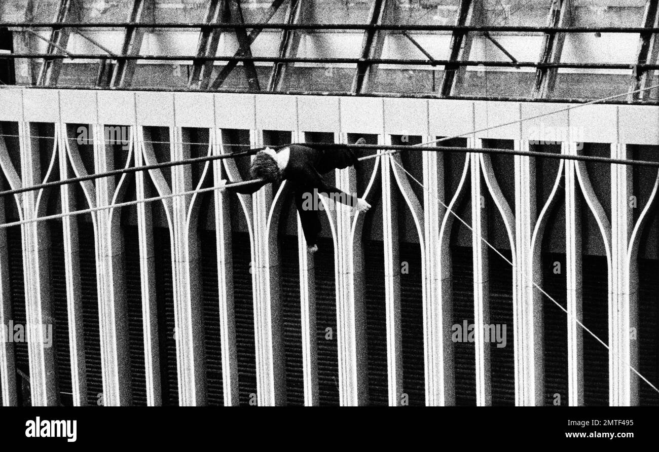 French high-wire aerialist Philippe Petit, lies across a cable ...